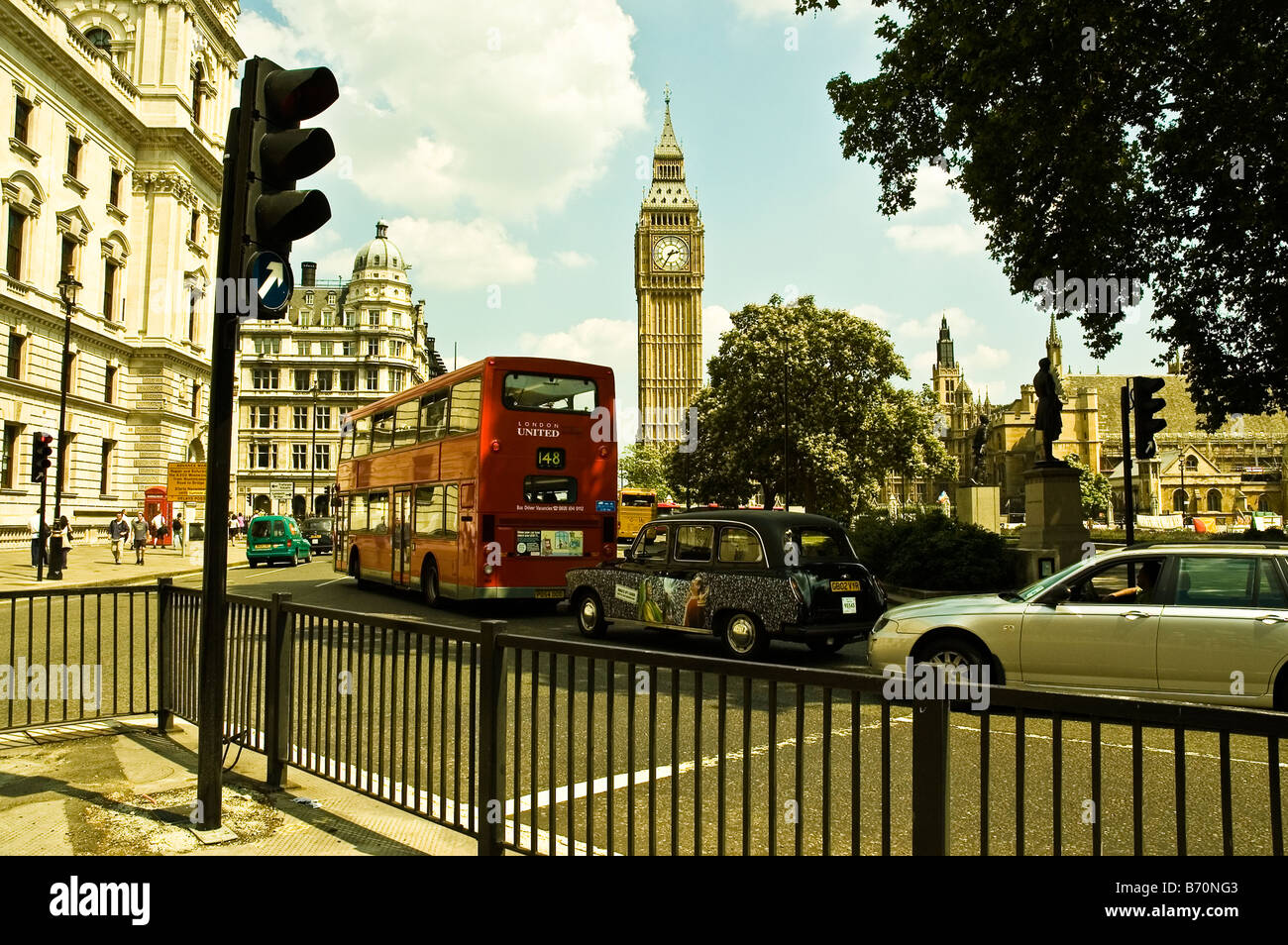 A view of the street with black taxis, red double decker buses and Big ...