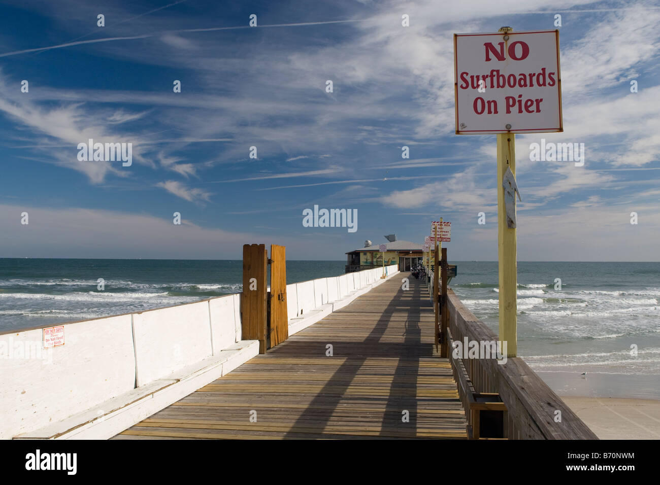 The pier in Daytona Beach Florida with a No Surfboards sign Stock Photo ...
