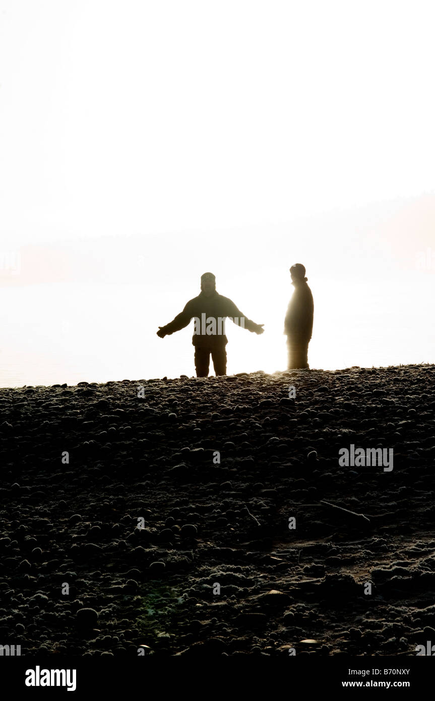 Silhouettes on beach Stock Photo - Alamy