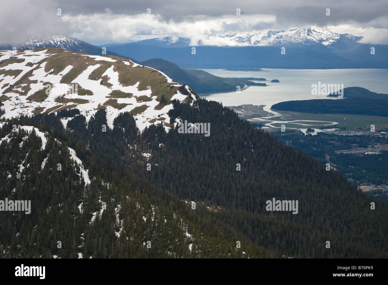 Aerial view of snow capped mountains above Juneau, Alaska Stock Photo ...