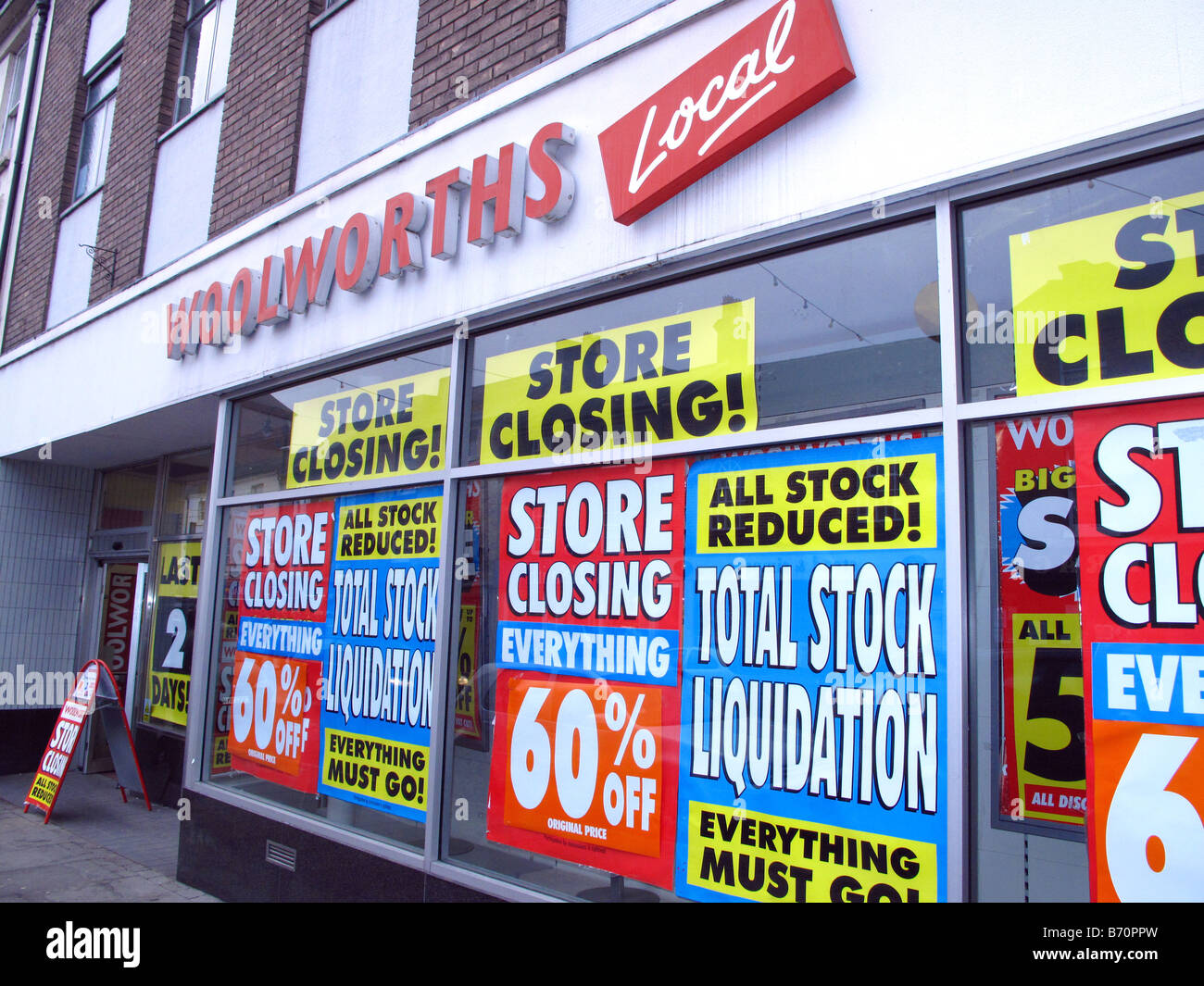 Frontal window liquidation sale signs in Woolwoths store after ...