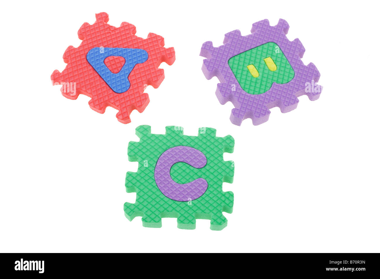 Colorful puzzle blocks with alphabets A B and C arranged on white ...