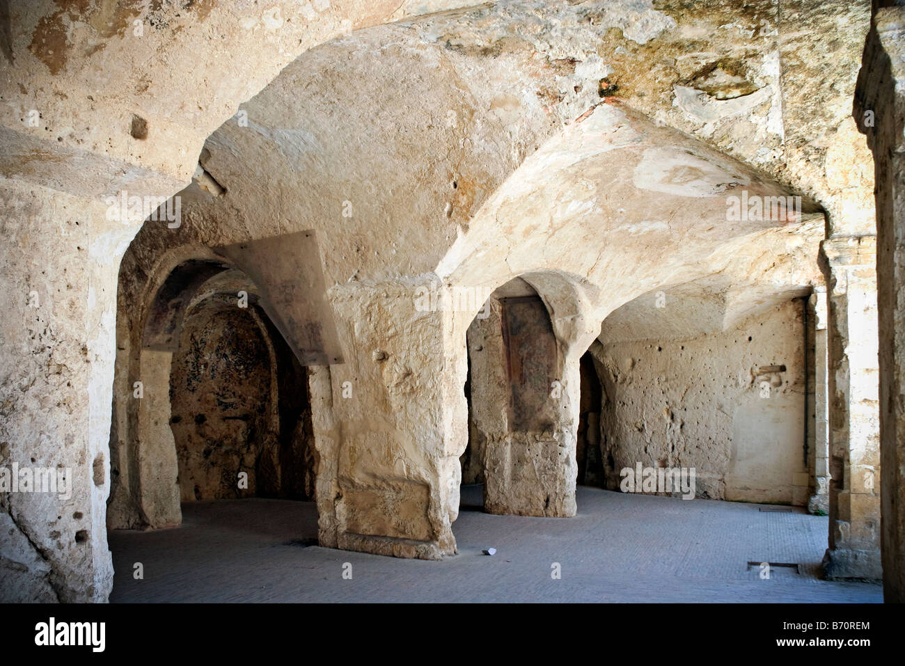 Ancient water cystern carved in tufo rock, centre of the old town ...