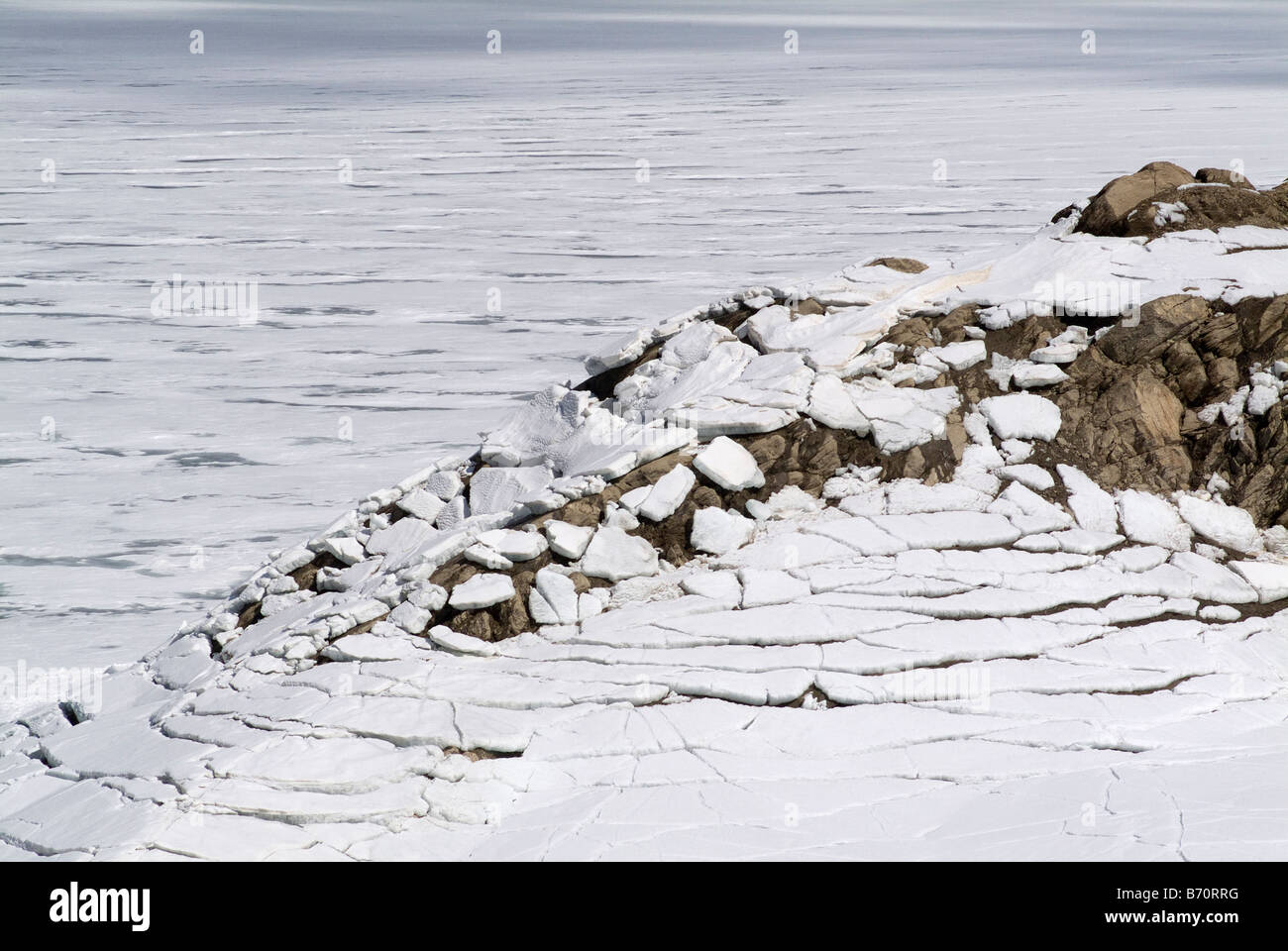 snow on a rock in swiss alps Stock Photo - Alamy