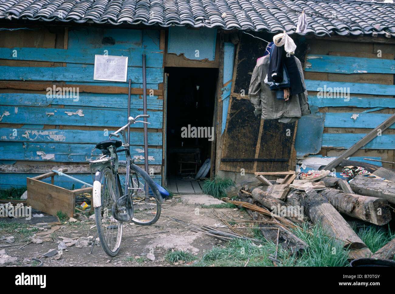 Migrant workers lodging hostel Shack Clothes line Bicycle SHANGRI-LA ...