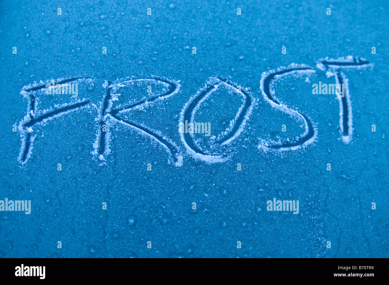 Word "frost" written on a window screen Stock Photo - Alamy