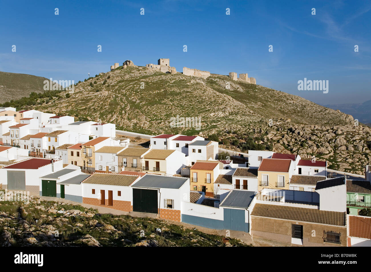 typical houses and castle de la estrella in village of Teba malaga ...