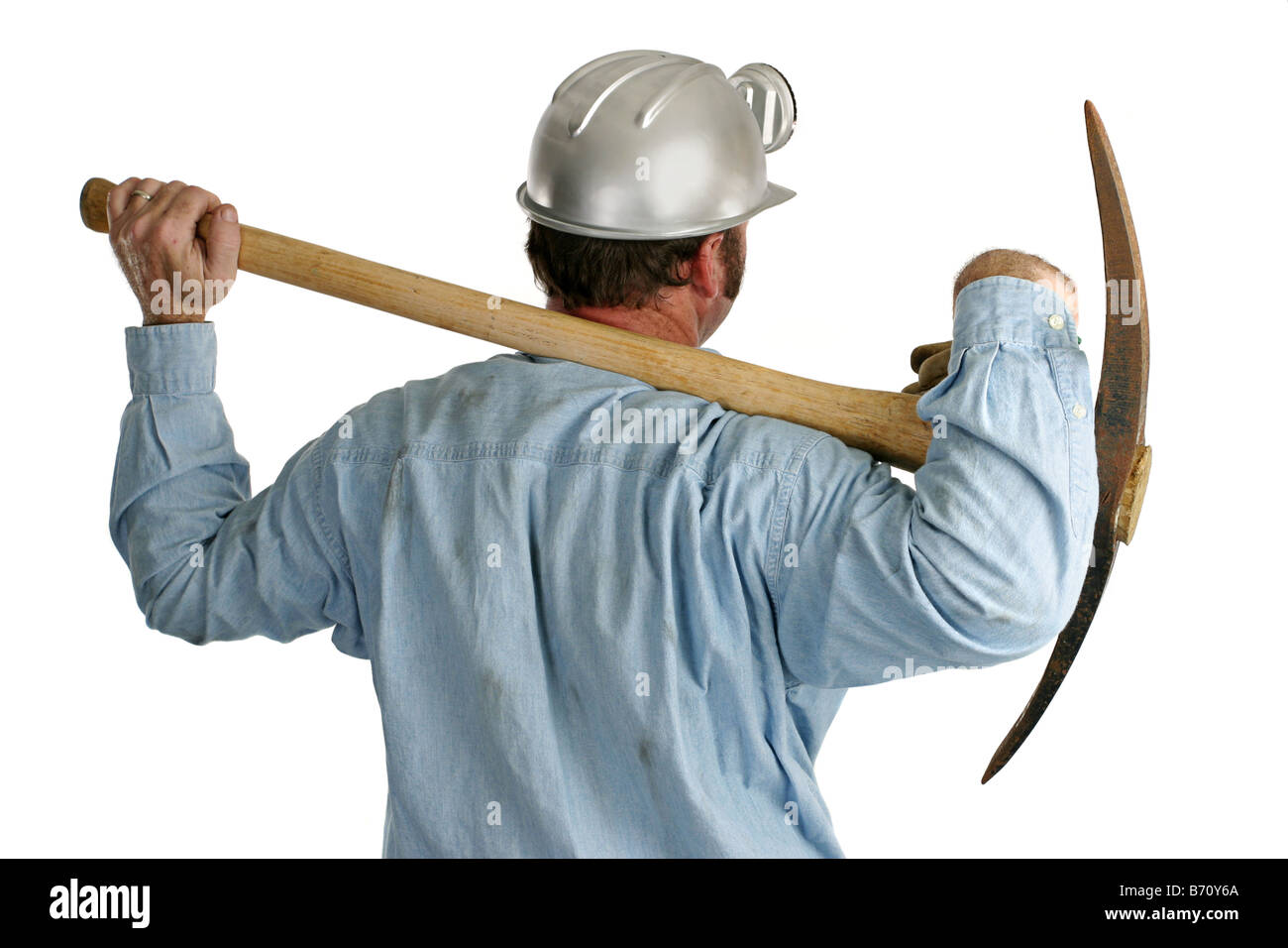 A view from behind a coal miner who s carrying a pickax on his ...