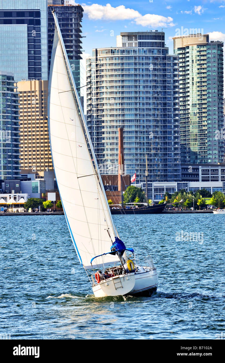 Sailboat sailing in Toronto harbour with downtown view Stock Photo - Alamy