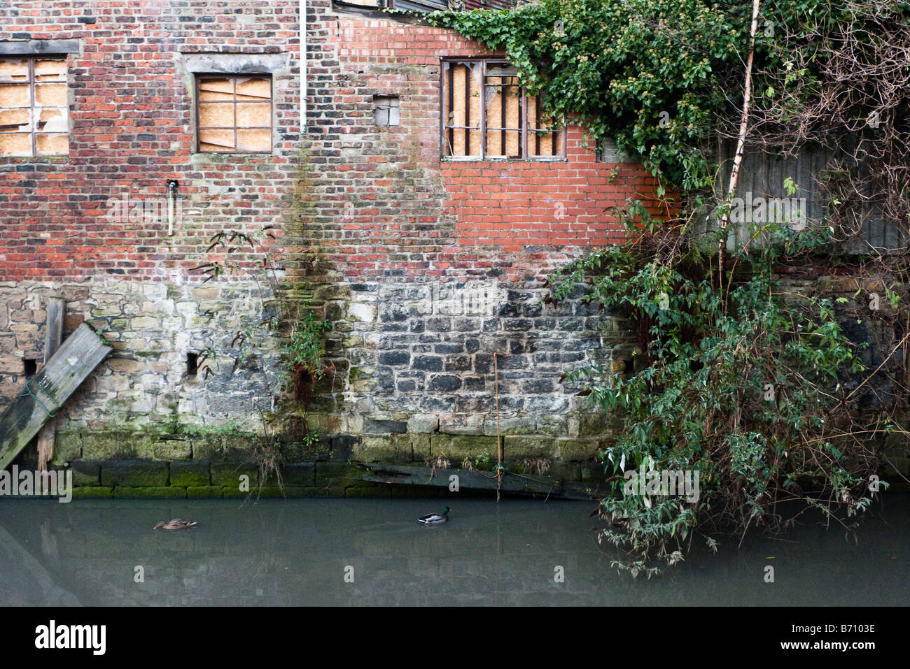 River Ouseburn flowing past derelict buildings in Newcastle upon Tyne ...
