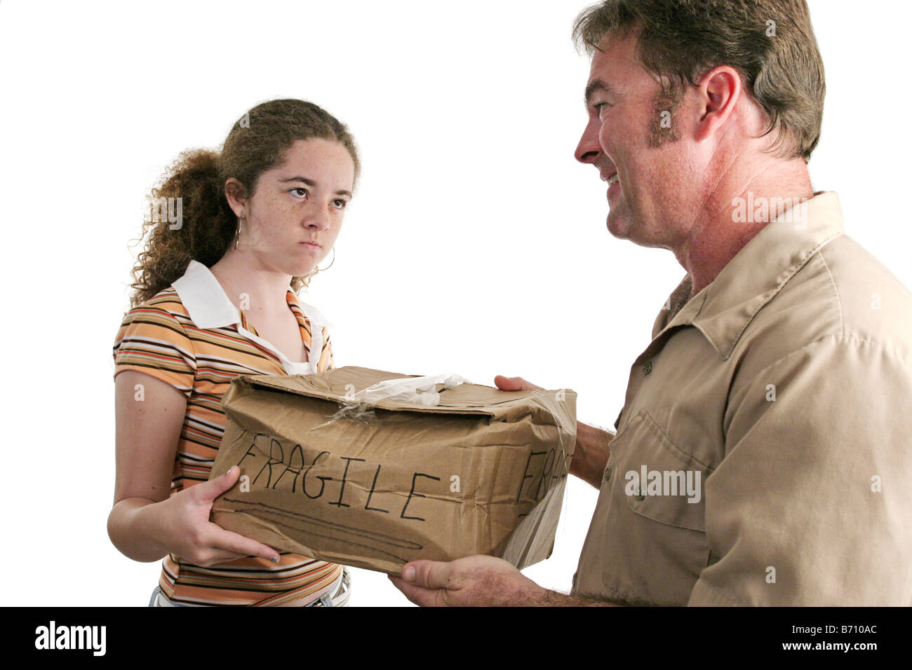 An angry customer receiving a smashed package from a delivery man focus ...