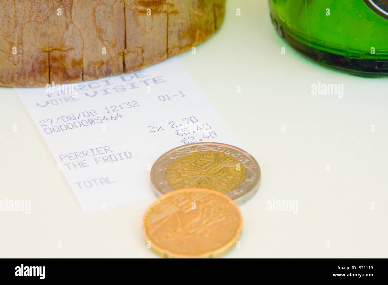 Cafe receipt and change on white table Stock Photo - Alamy