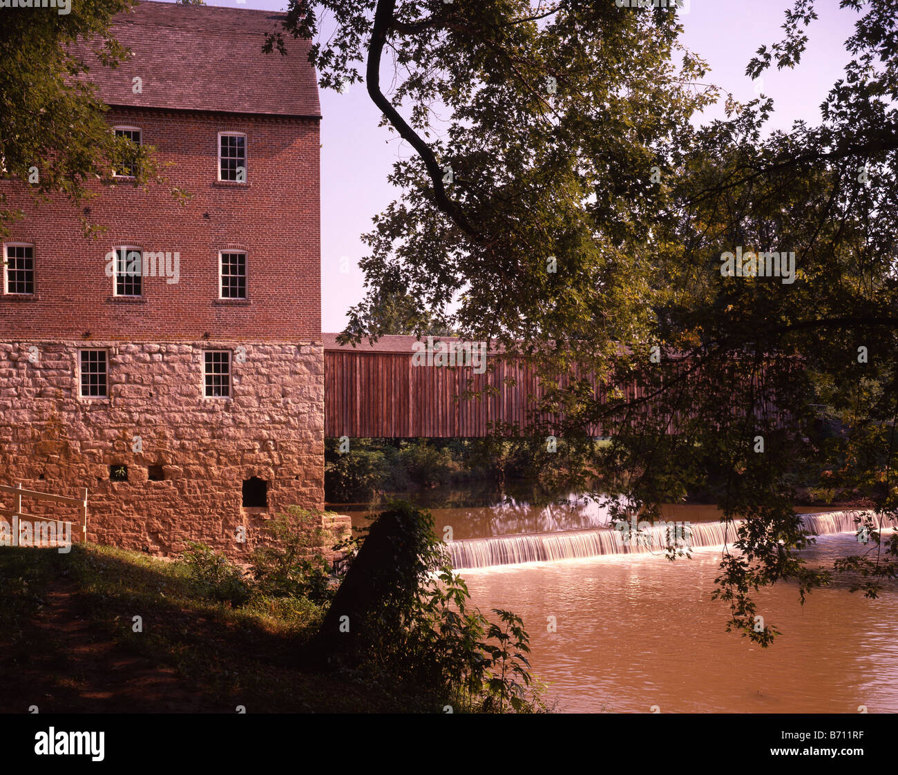 Old Mill with Covered Bridge Stock Photo - Alamy