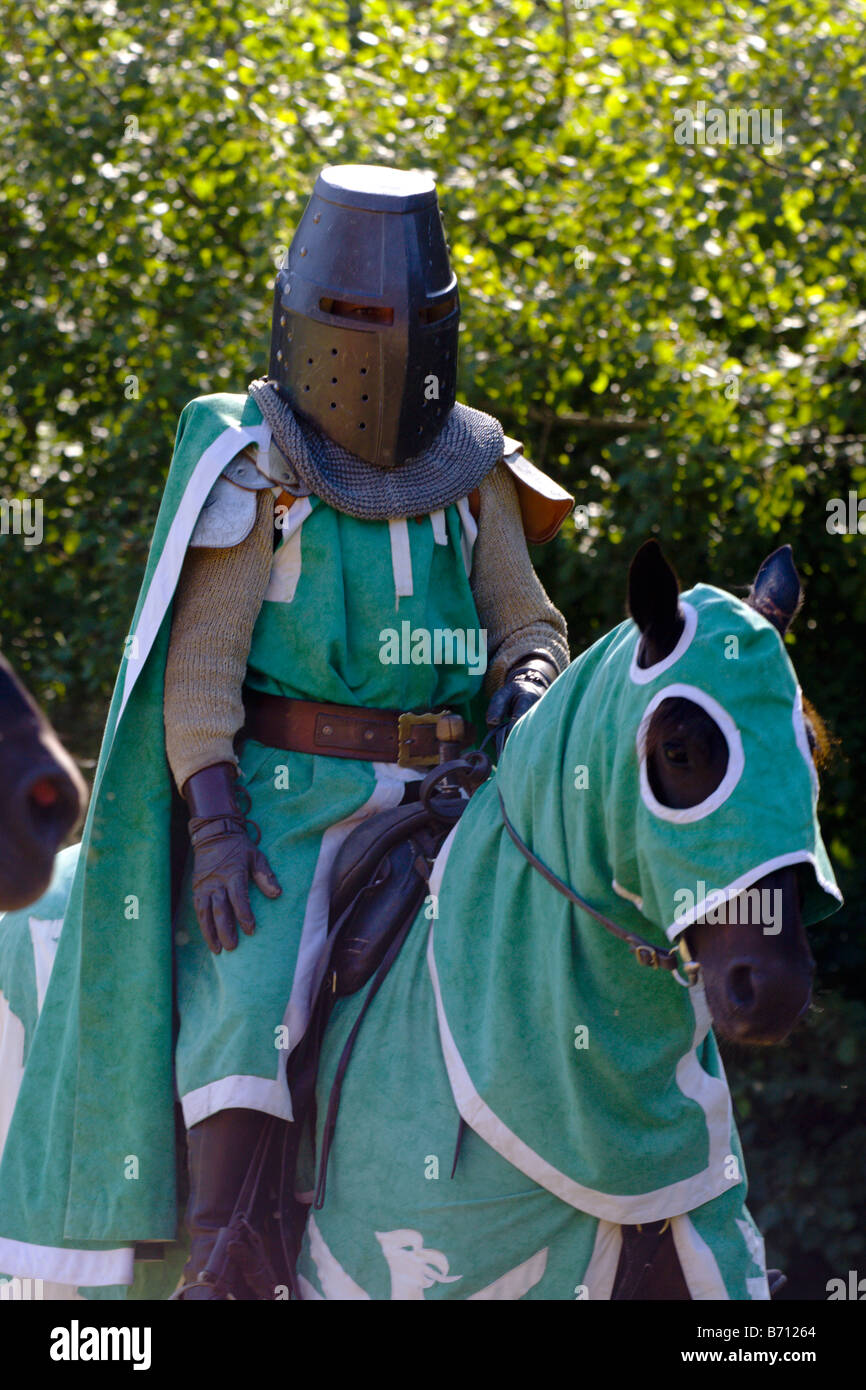 Knight in armour on horseback at Mediaeval fair in France Stock Photo ...