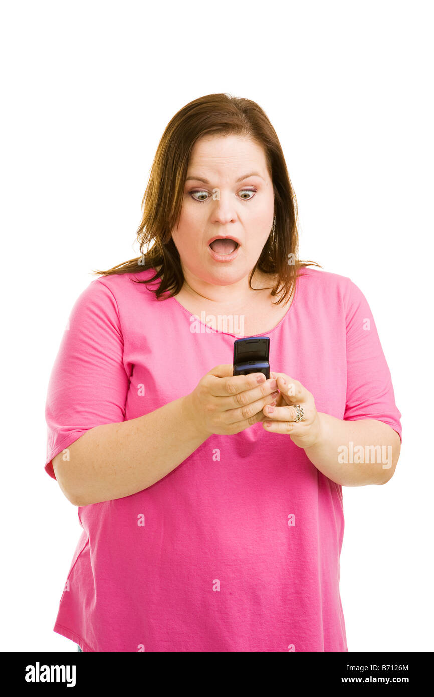 Pretty plus sized woman reacting with shock to a text message she ...