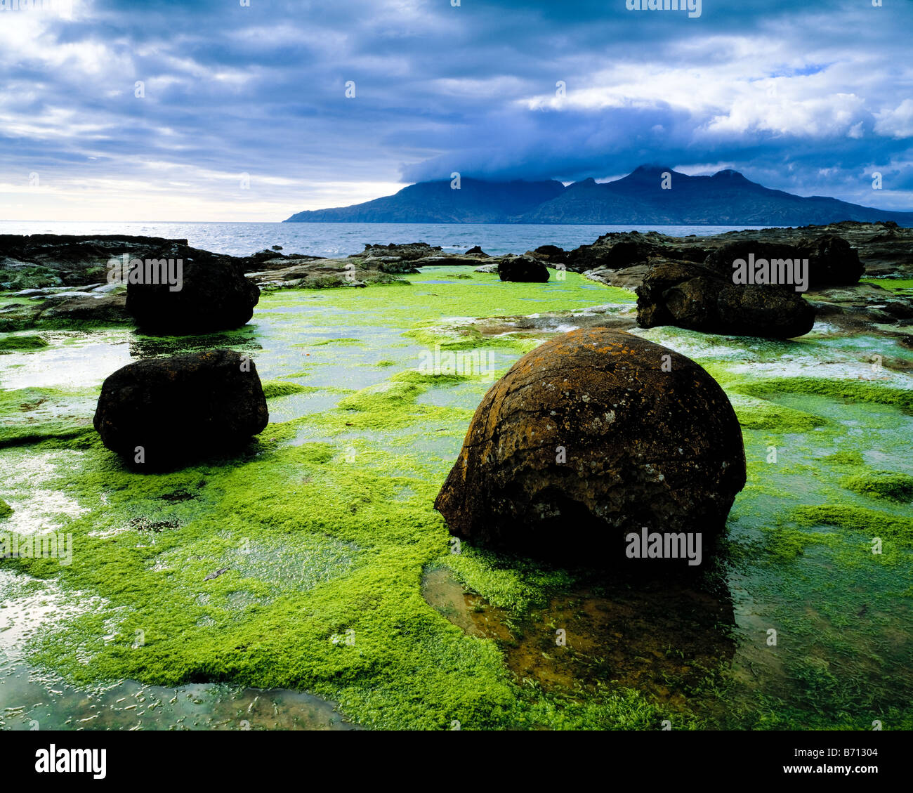 The bay of Laig, Rum in the distance. Isle of Eigg. Scotland Stock ...