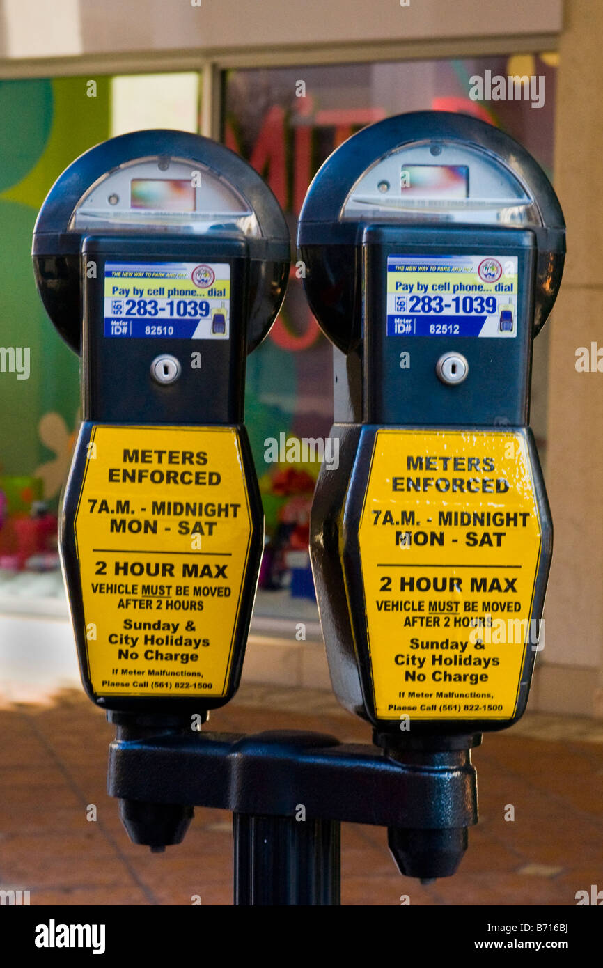 Palm Beach , coin operated parking meters with sign saying pay by cell ...