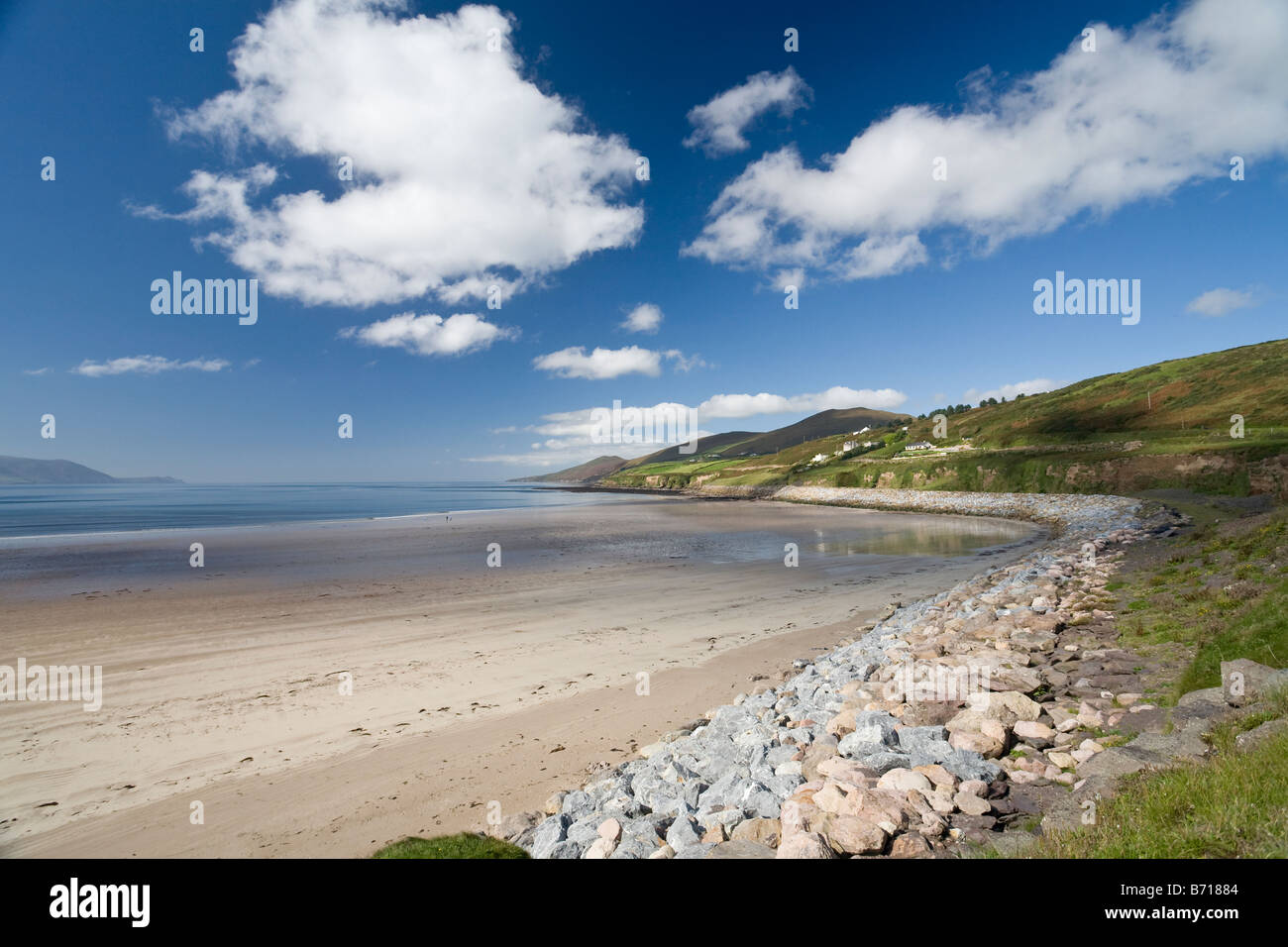 Wide open Beach Exploration. Three people explore an almost deserted ...