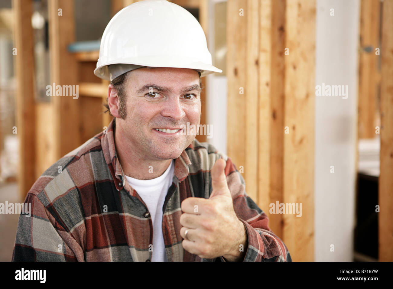 Horizontal view of a construction worker giving a thumbs up Authentic ...