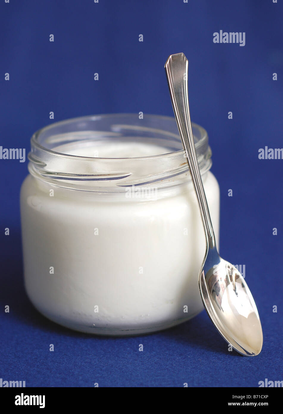 yogurt on blue background Stock Photo - Alamy