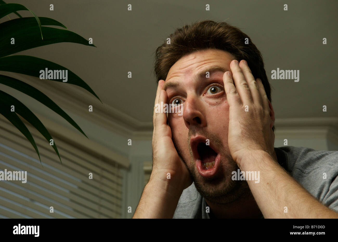 A shocked looking man Stock Photo - Alamy