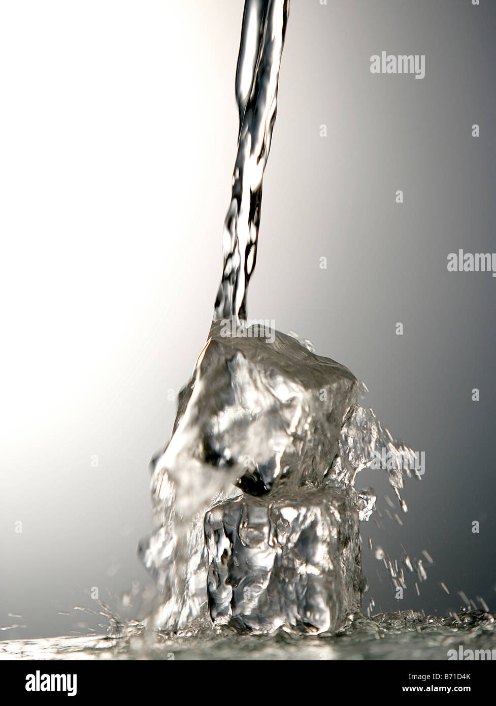 Water Pulling Ice cube Splashing Stock Photo - Alamy