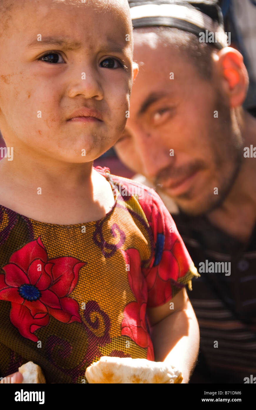 Man with daughter Kashgar Xinjiang China Stock Photo - Alamy