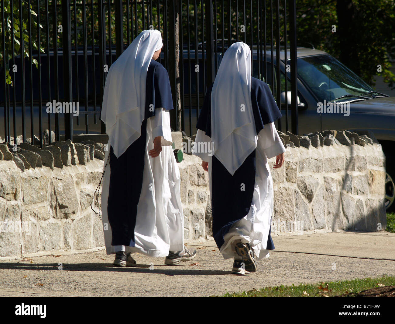 Two nuns donning traditional Catholic habits with sneakers out for an ...