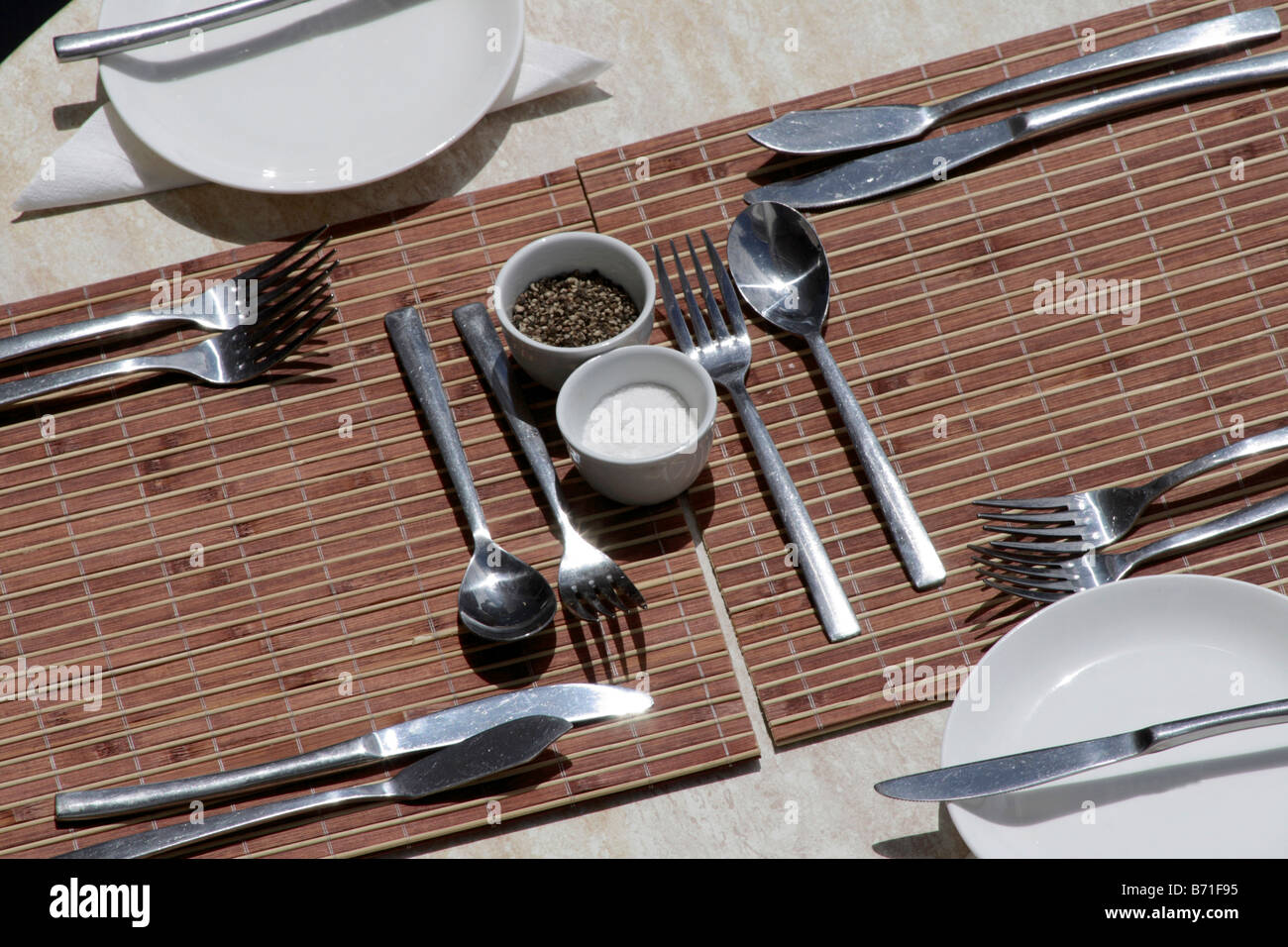 Table laid with cutlery and porcelain Stock Photo - Alamy