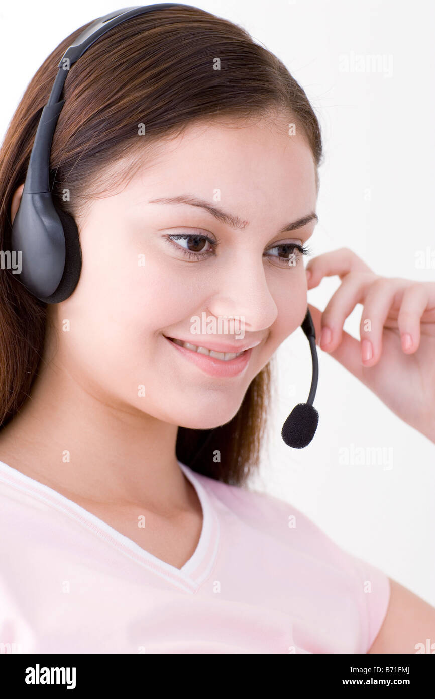 Teenage girl wearing headset smiling portrait Stock Photo - Alamy