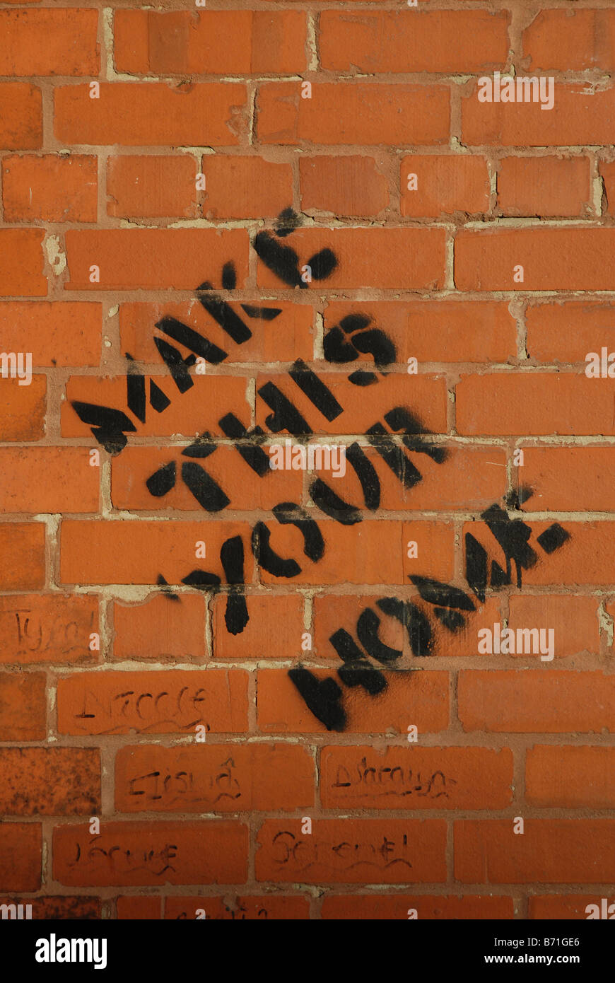 Graffiti on the side of a boarded up house in the north of England ...
