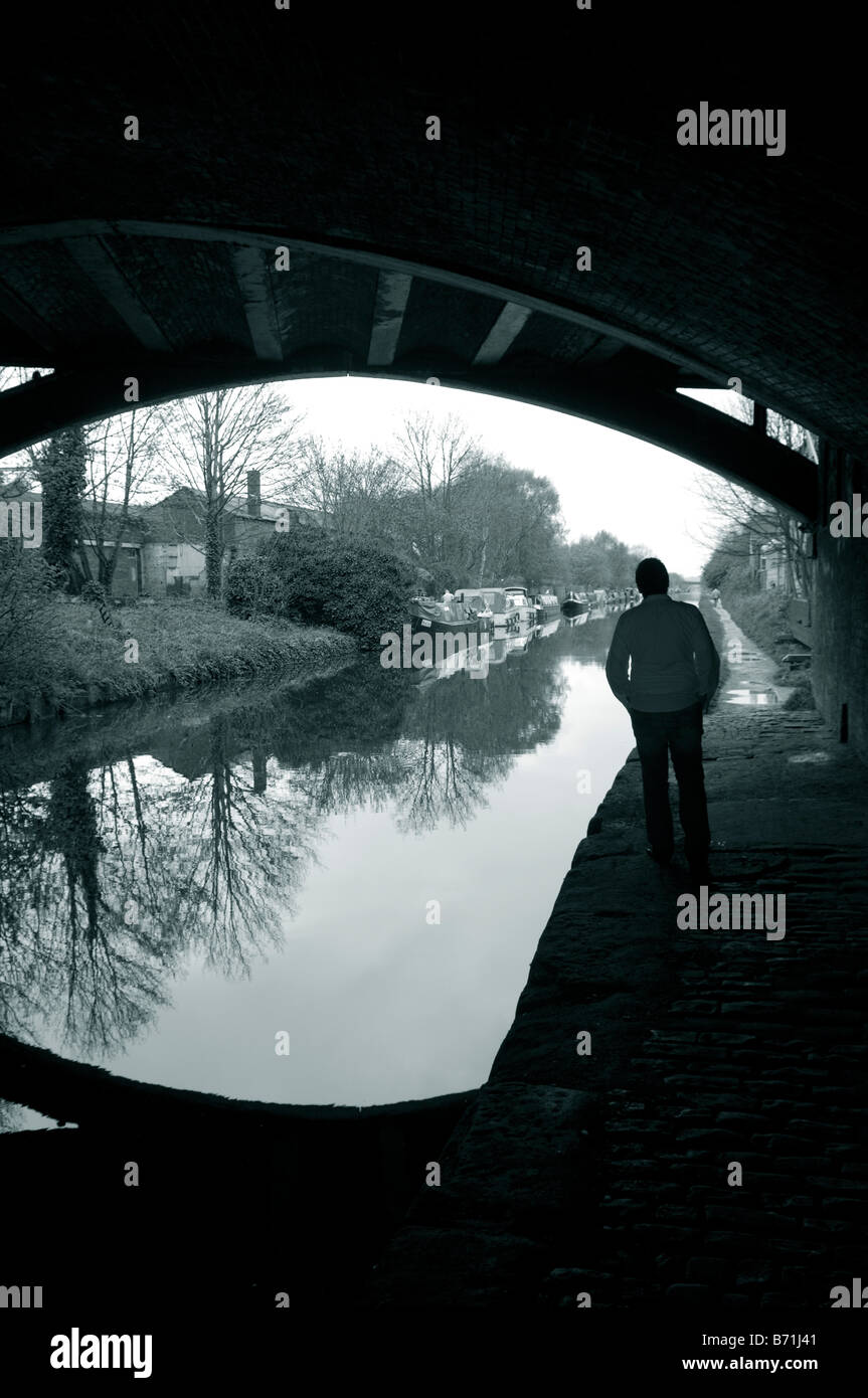 Silhouette man walking under bridge hi-res stock photography and images ...