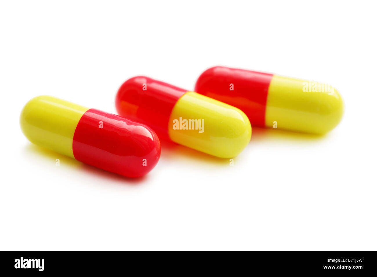 Red yellow capsules drugs hi-res stock photography and images - Alamy