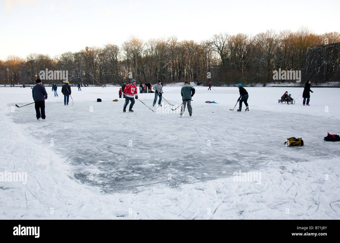 people playing ice hockey on a frozen lake Stock Photo - Alamy