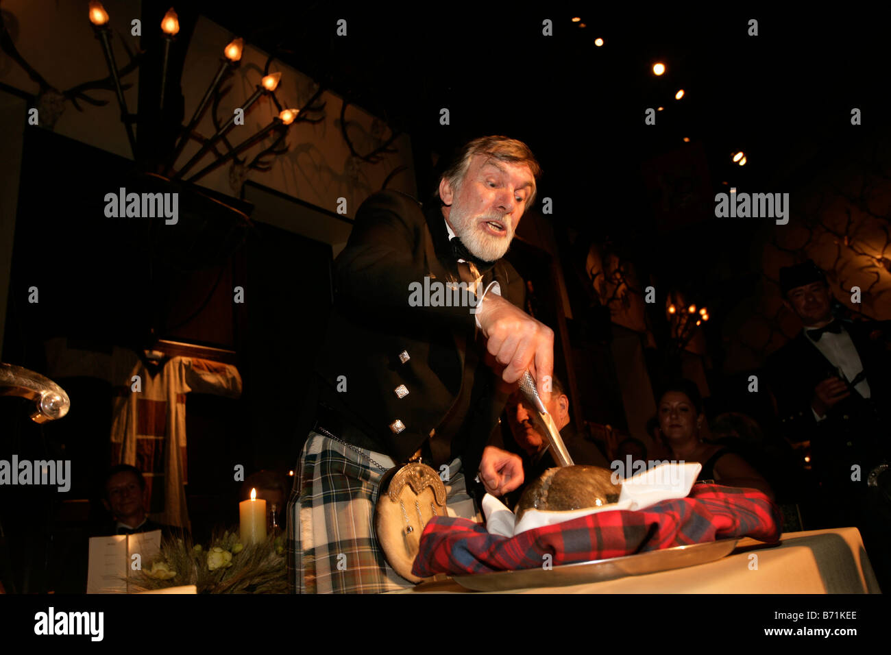 Addressing the haggis at a traditional Burns Night Supper Stock Photo ...