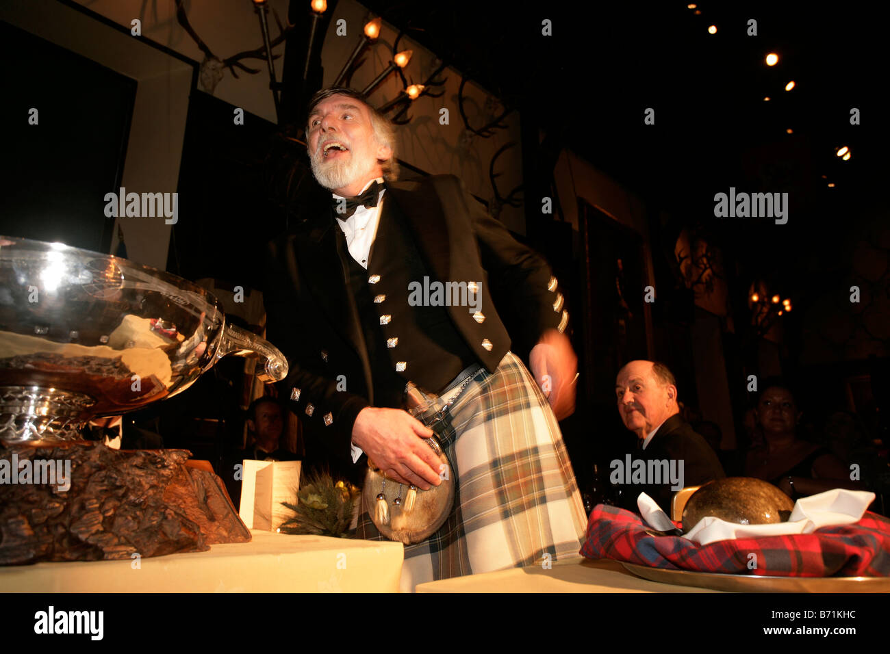 Addressing the haggis at a traditional Burns Night Supper Stock Photo ...