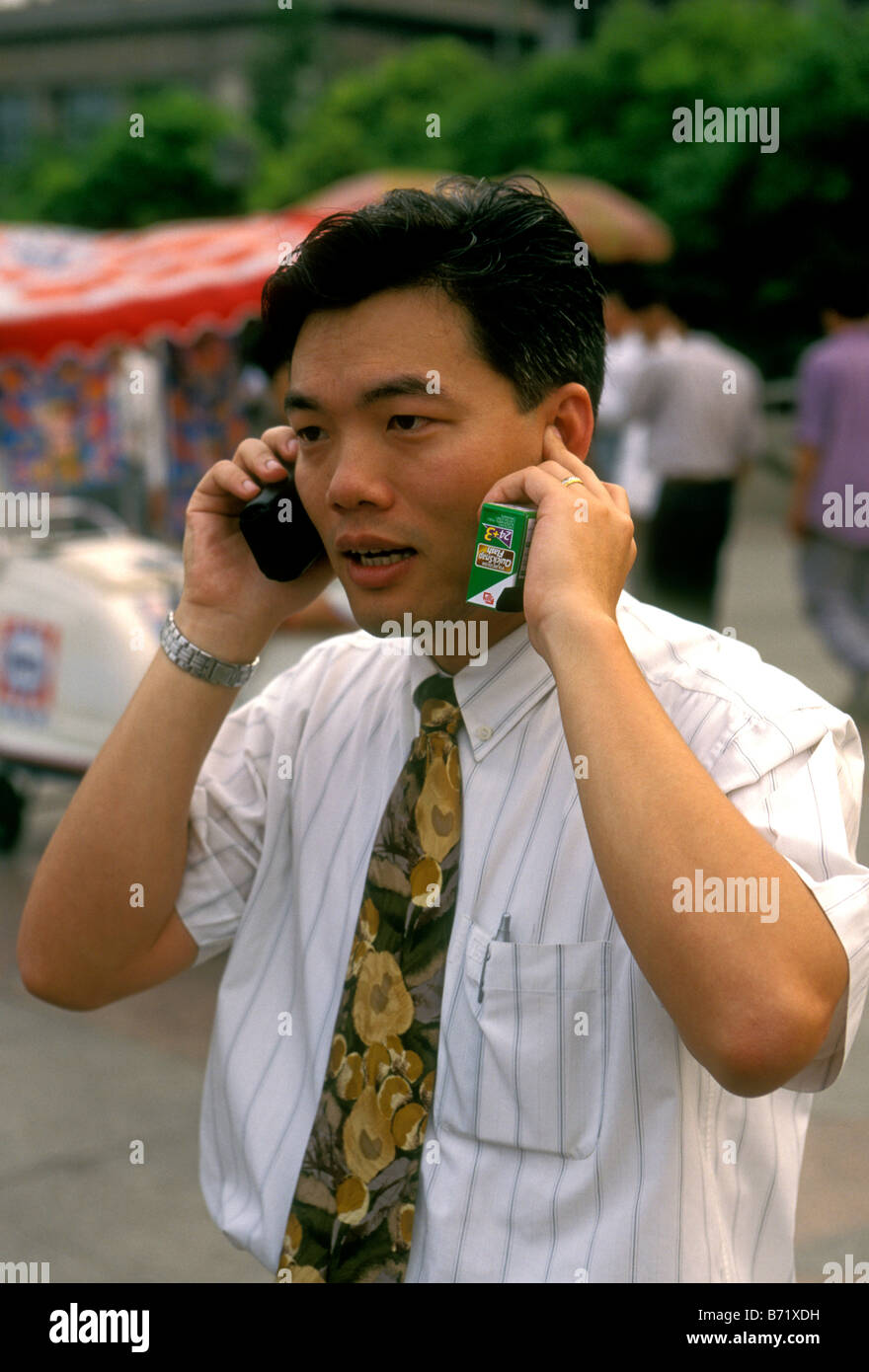 1, one, Chinese man, businessman, talking on cellphone, cell phone ...