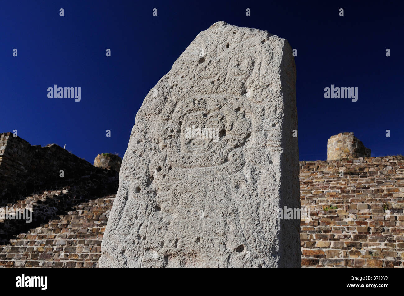 Monte Alban archaeological site, Stela 9 obelisk with carving of richly ...