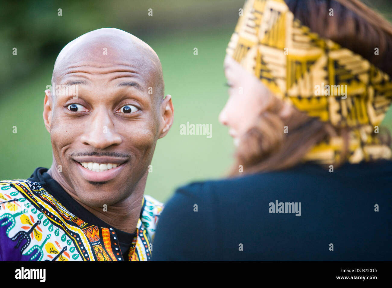 Happy African American couple dressed in traditional African attire ...