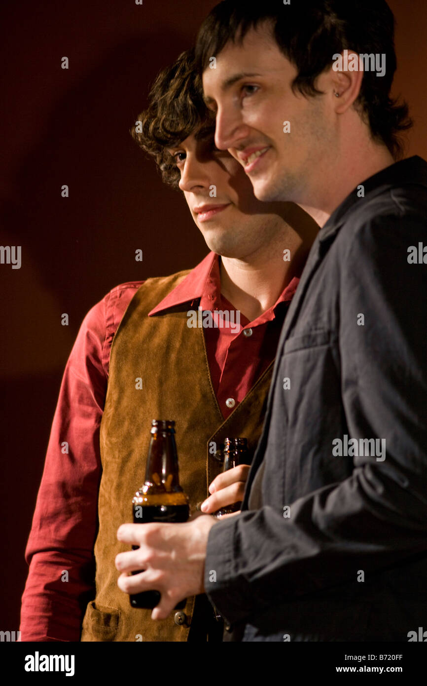 Two young men drinking beer Stock Photo - Alamy