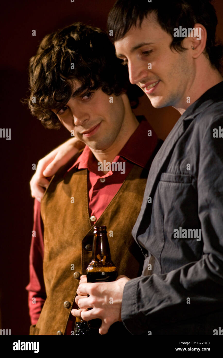 Two young men drinking beer Stock Photo - Alamy