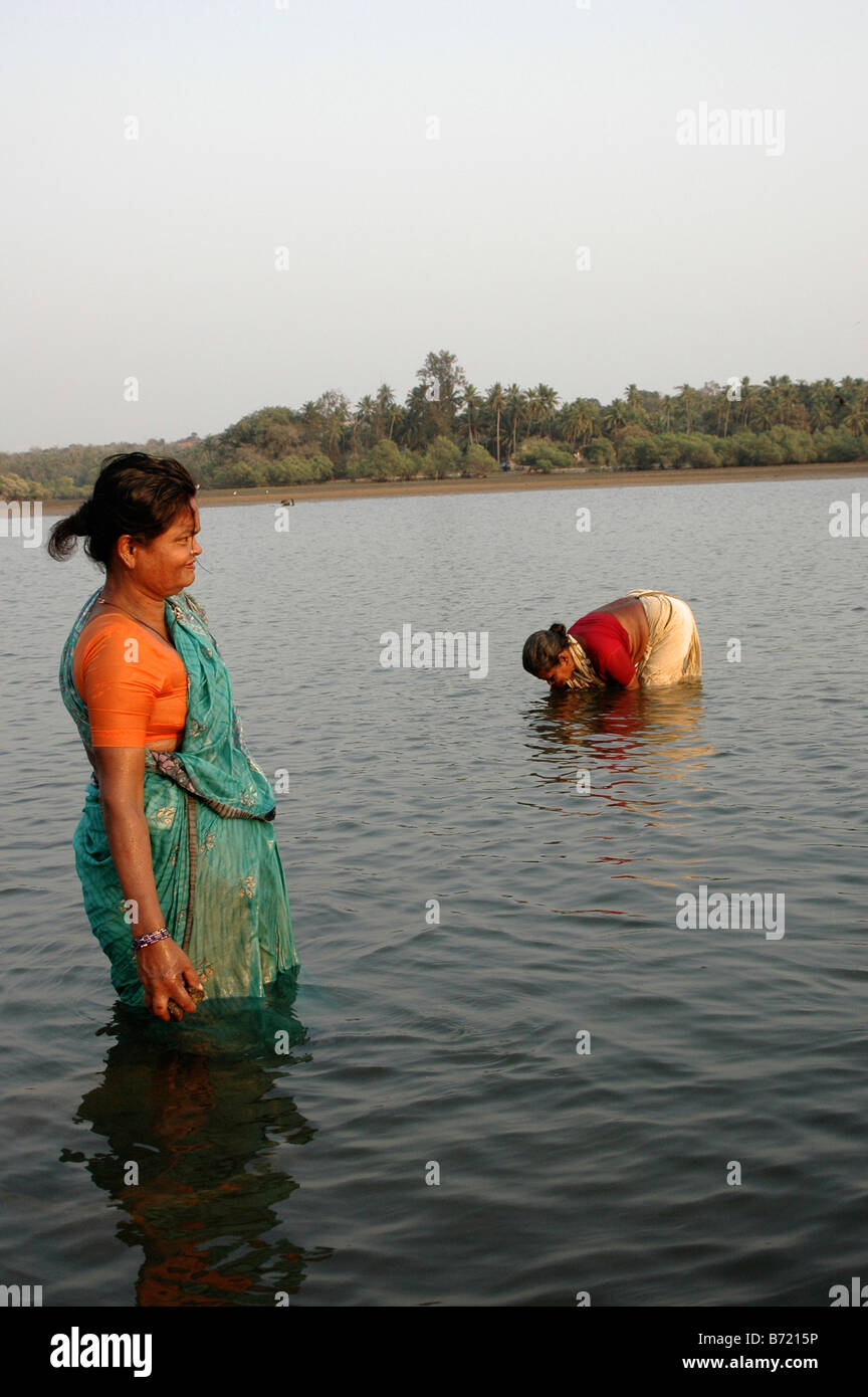 Indian woman bathing in river hi-res stock photography and images - Alamy