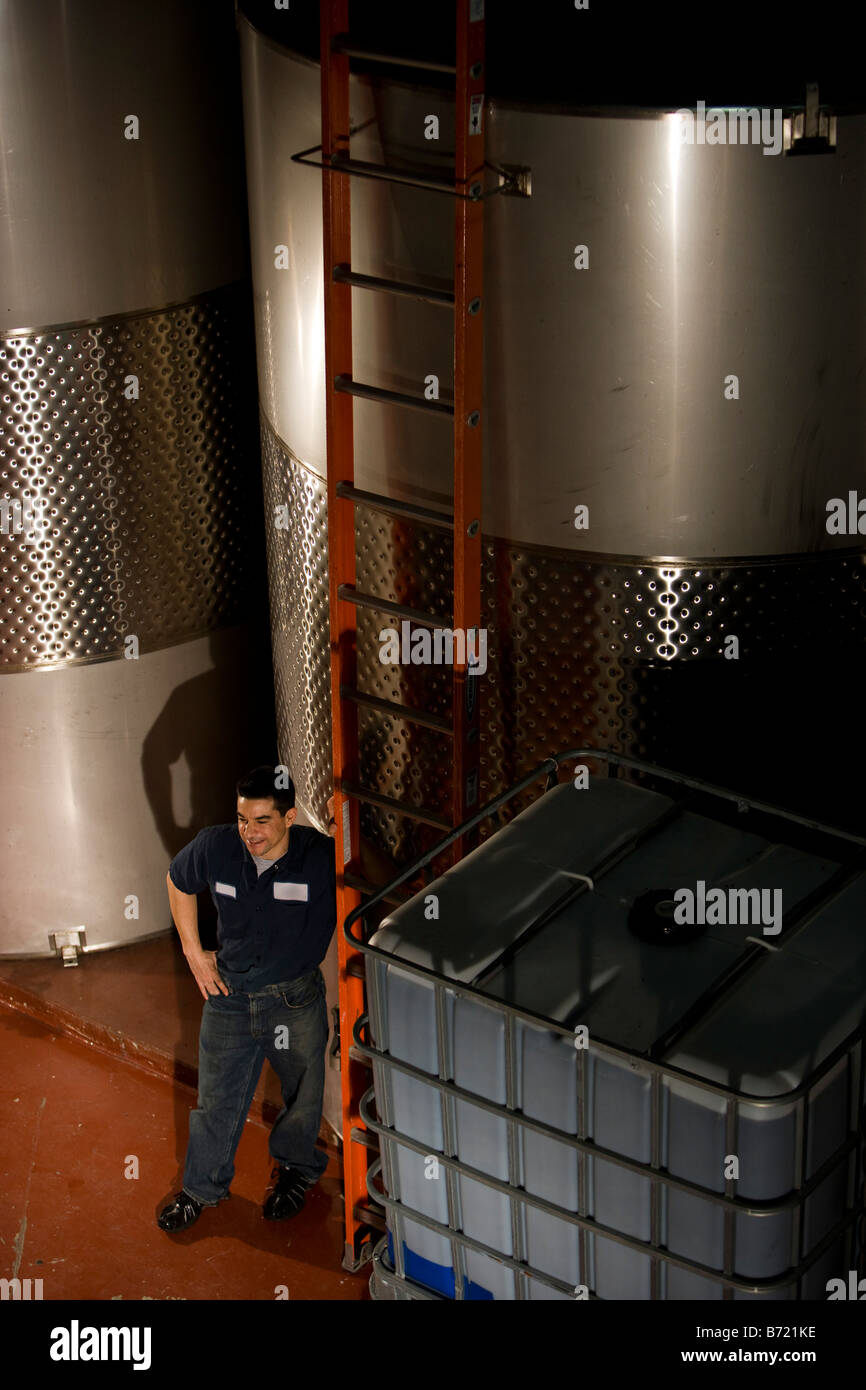 Worker standing ladder tank hi-res stock photography and images - Alamy