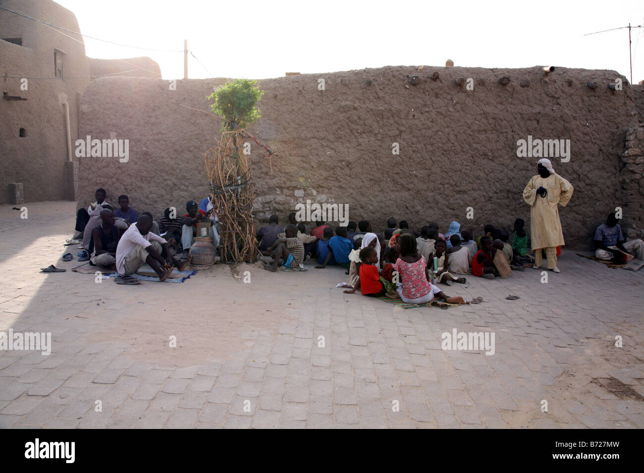 The pupils learn Coran in front of the house of the marabout in the old ...