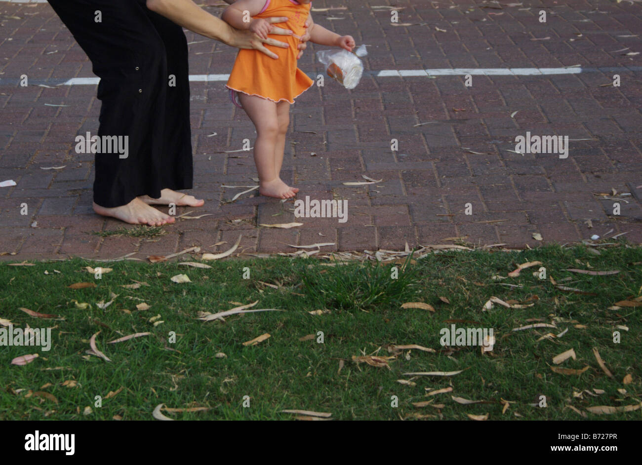 Toddler learning to walk Stock Photo - Alamy