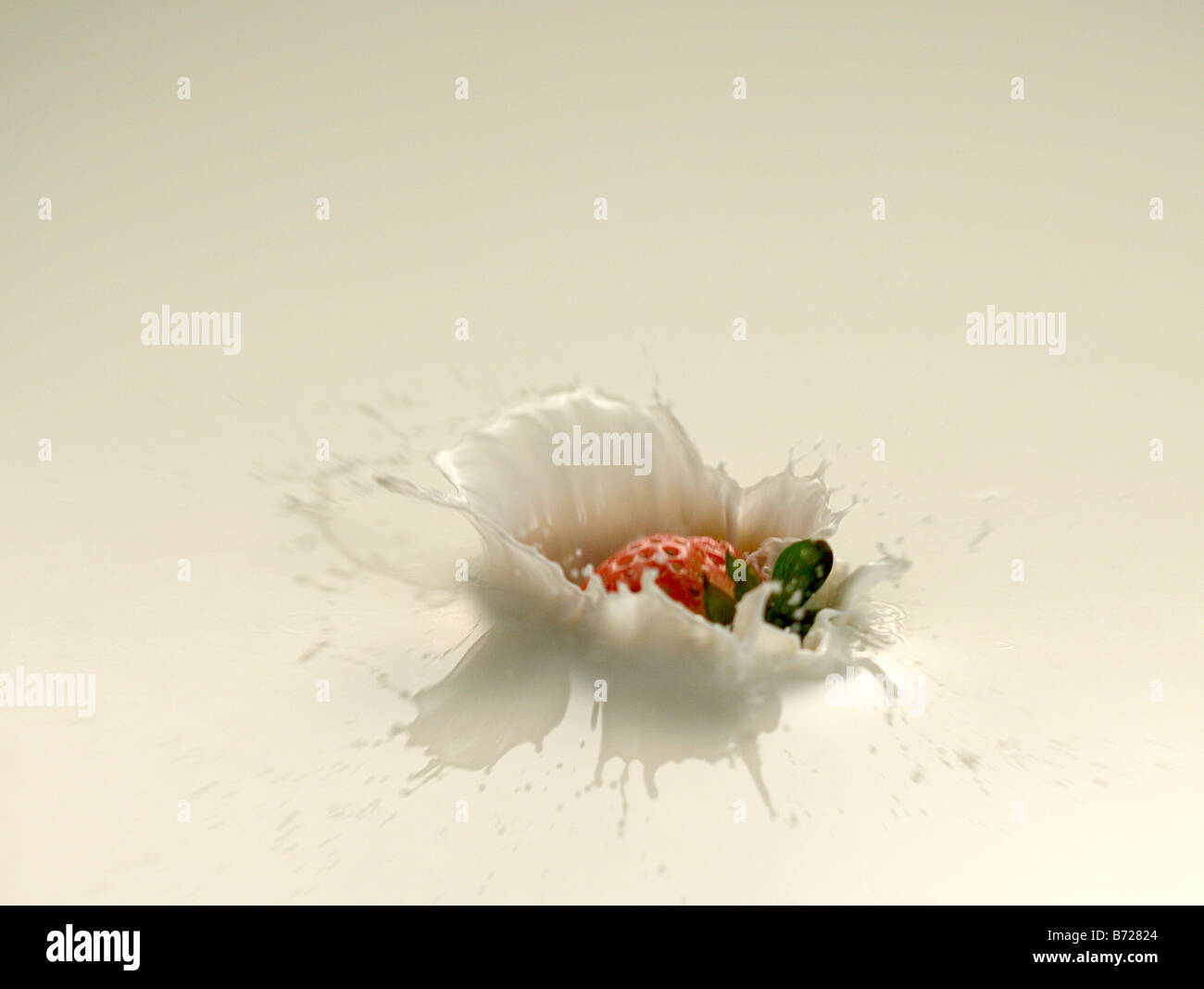Milk Spray Splashing Strawberry Stock Photo - Alamy