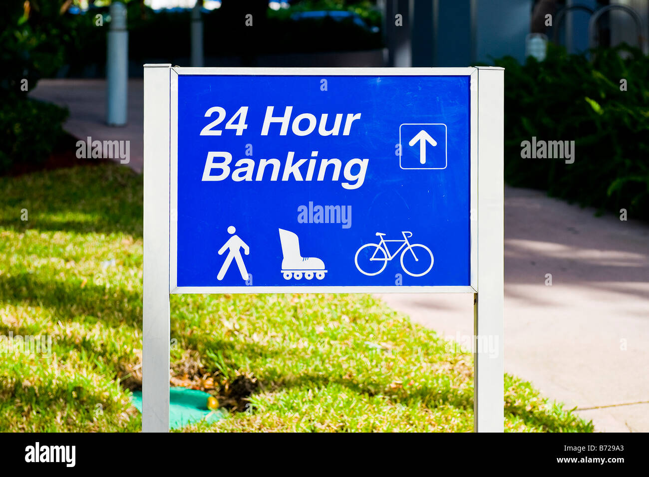 Miami sign showing 24 hour banking for pedestrians roller bladers ...