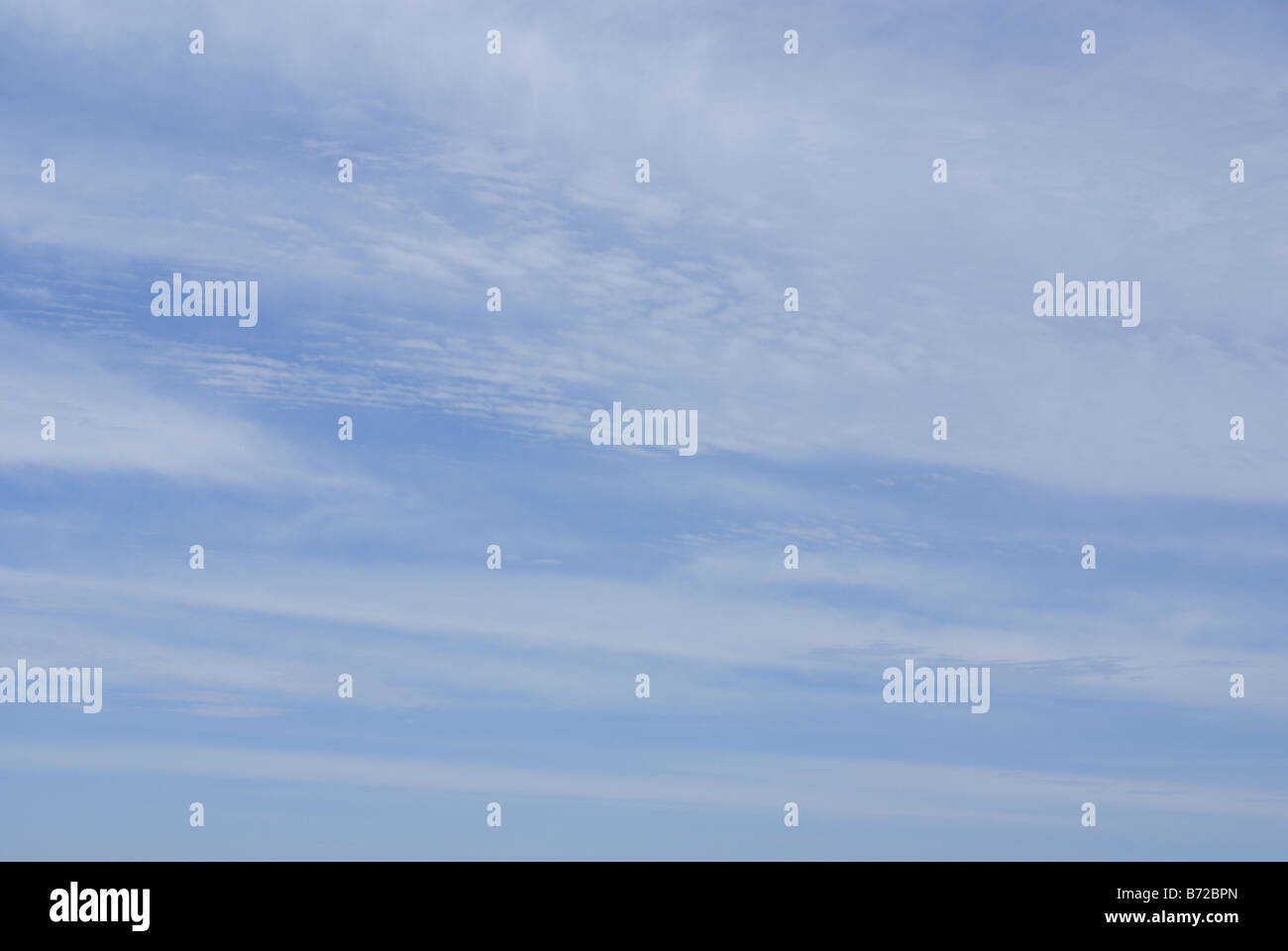 Clouds in a blue sky Stock Photo - Alamy