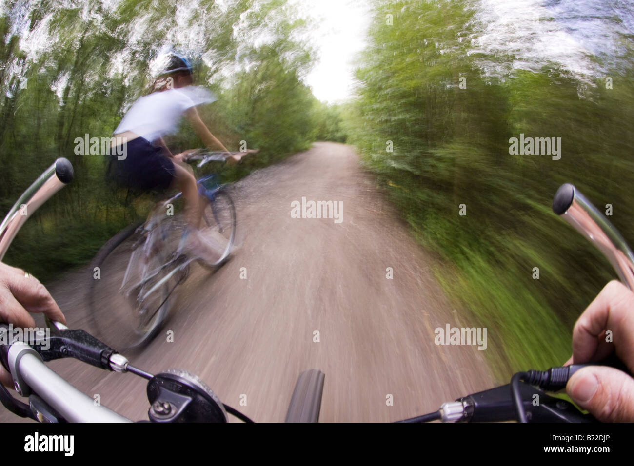 Bike riding off road along a woodland track Stock Photo - Alamy