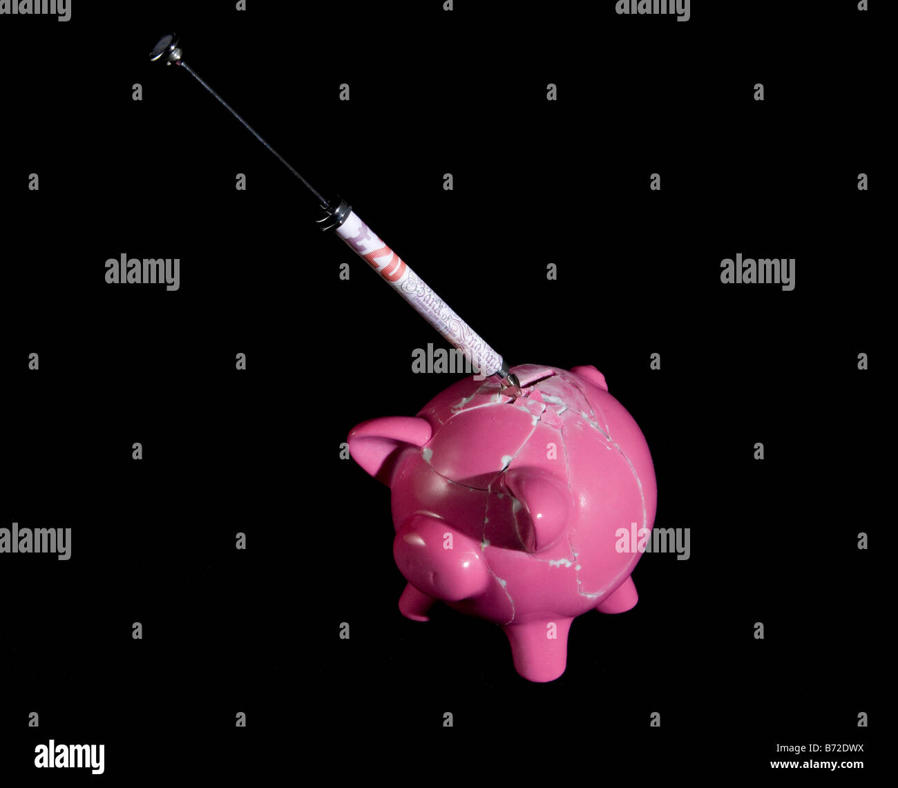 broken piggy bank with cash injection Stock Photo - Alamy